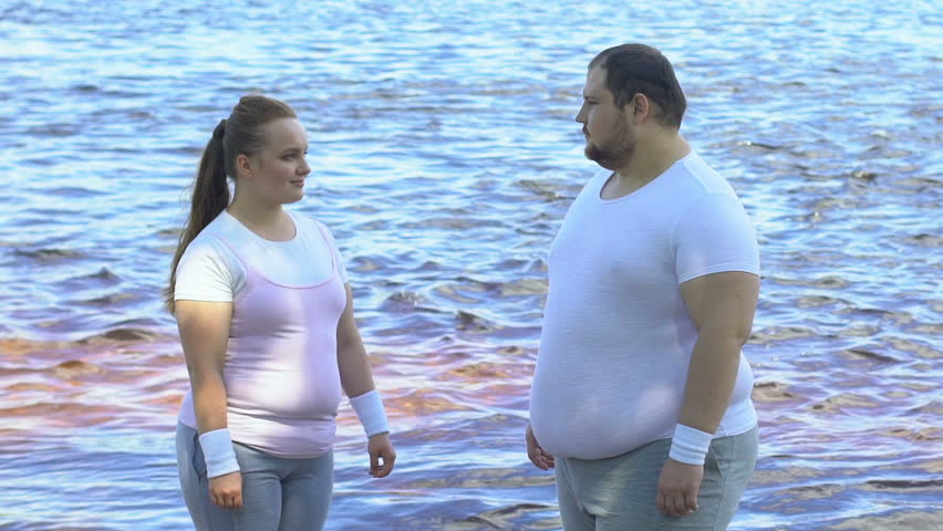 pretty overweight female hugging her boyfriend Stock Footage Video (100 ...