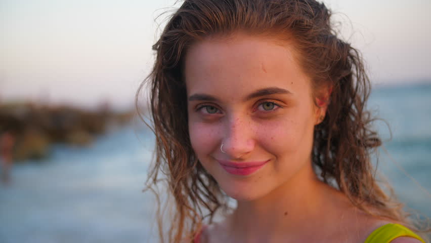 Caucasian Womans Feet Wearing An Ankle Bracelet On A Beach With Sea