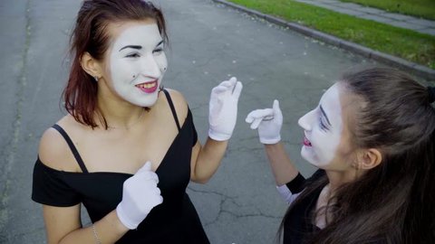 Two Girls Mimes Imitate Embarrassment When Stock Footage Video (100% ...