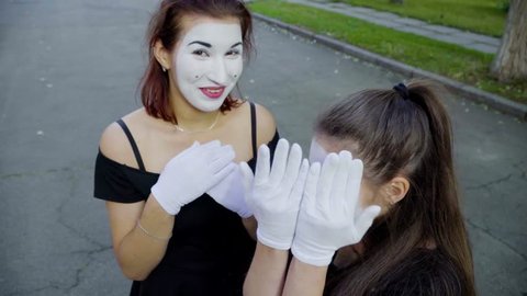 Two Girls Mimes Imitate Embarrassment When Stock Footage Video (100% Royalty-free) 1015028287 ...