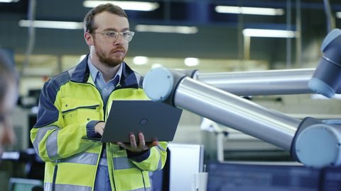 Factory Automation Engineer Uses Laptop Programming Stock Photo (Edit ...
