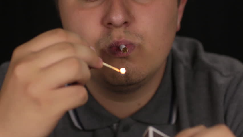 man lights cigarette using wooden match Stock Footage Video (100% ...