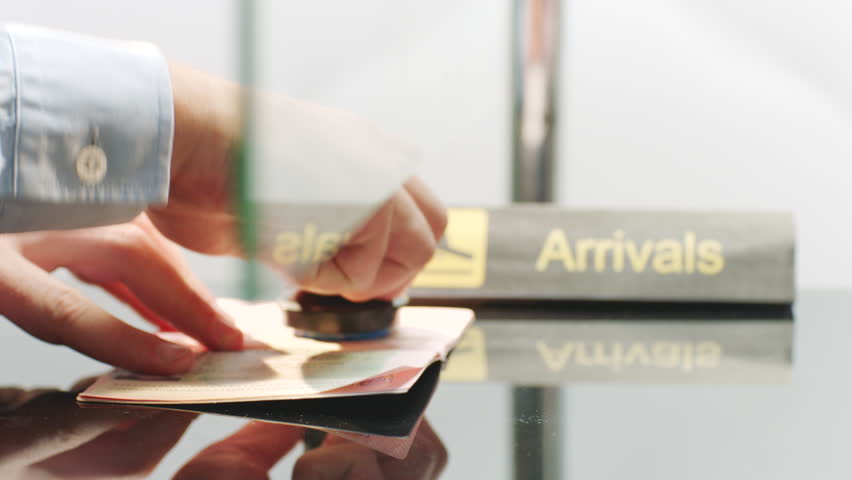 customs officer stamping travelling passport arrivals Stock Footage ...