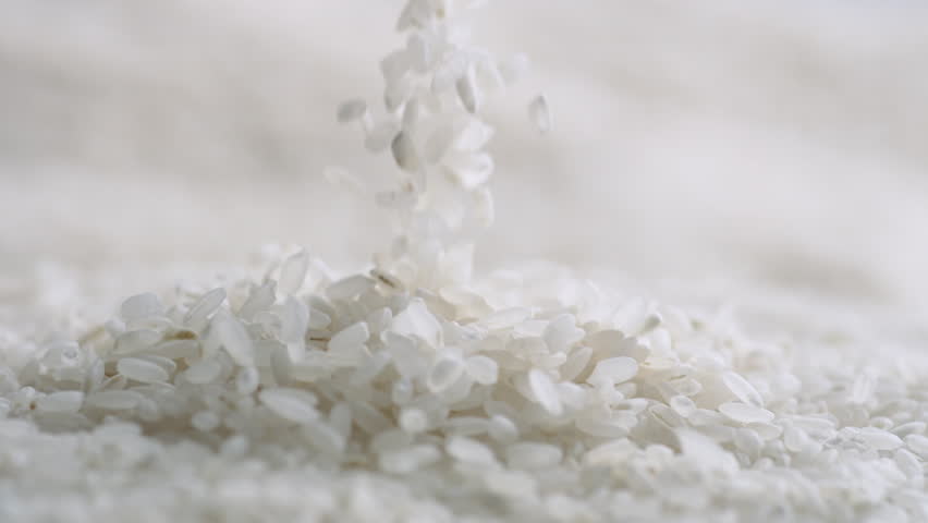 throwing rice over pile shot high Stock Footage Video (100% Royalty ...