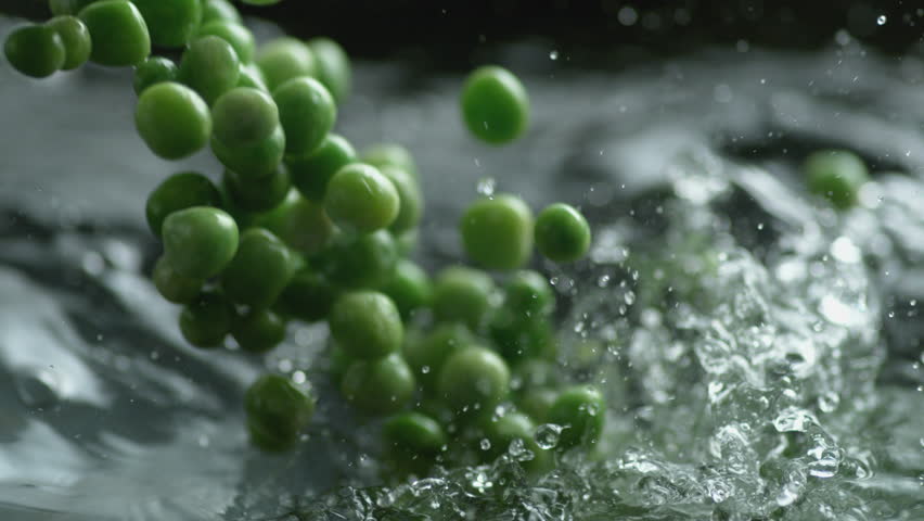 throwing peas into boiling water shot Stock Footage Video (100% Royalty ...