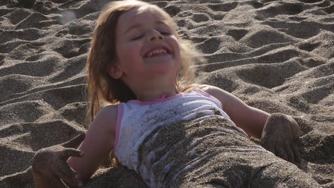 Child Buried Beach Sand Smiling Playing Stock Footage Video (100% ...