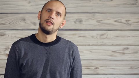 Young Guy Contempt Looks Background Wooden Stock Footage Video (100% ...