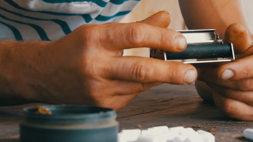 men's hands make handmade cigarette roll-ups Stock Footage Video (100% ...