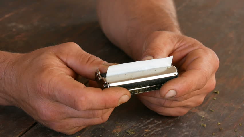 men's hands make handmade cigarette roll-ups Stock Footage Video (100% ...