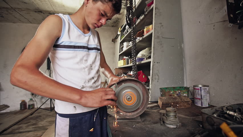 Teenager Using Grindstone Workshop: video de stock (totalmente libre de ...