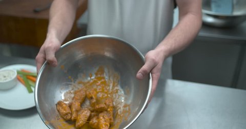 Male Chef Tossing Chicken Wings Buffalo Stock Footage Video (100% ...