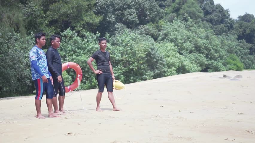 Three Asian Lifeguards Watching On Stock Footage Video (100% Royalty ...