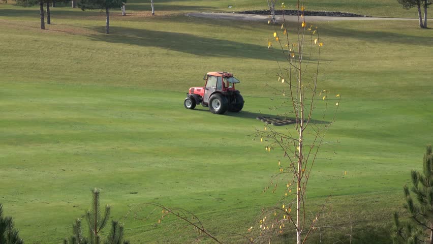 tractor prepares grass golf course top Stock Footage Video (100% ...