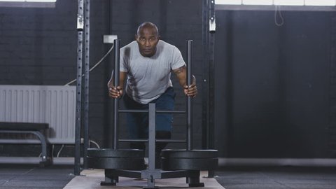 African American Male Pushing Weight Sled Stock Footage Video (100% ...