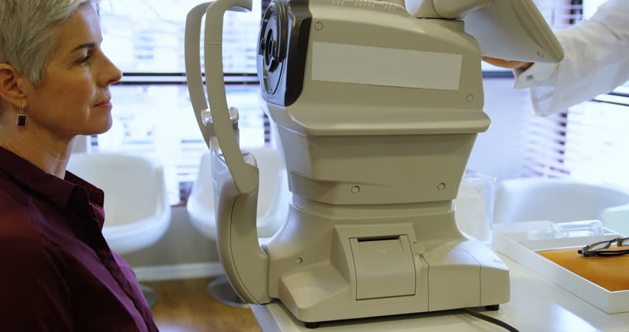 Side View of Optometrist Examining Stock Footage Video (100% Royalty ...