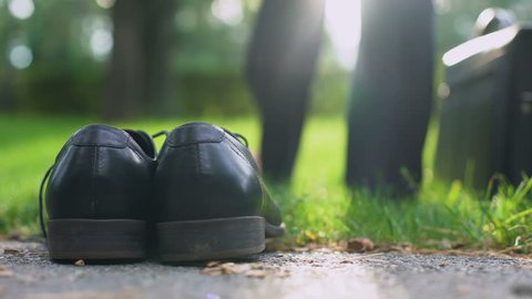 Man taking off shoe Stock Video Footage - 4K and HD Video Clips ...