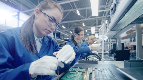 Wide Shot Female Electronics Factory Worker Stock Footage Video (100% ...