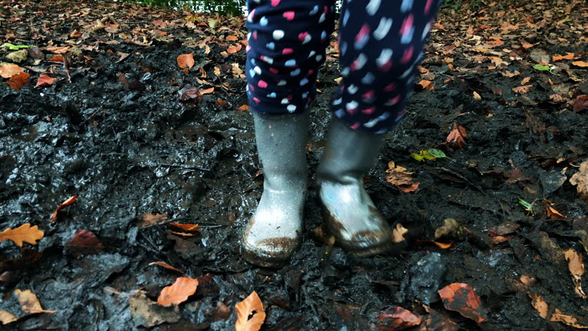young girls wellies playing muddy puddle Stock Footage Video (100% ...