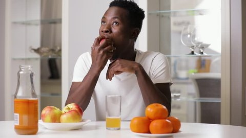 African American Man Eating Apple Stock Footage Video (100% Royalty ...