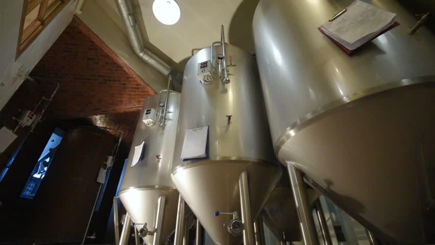 Old beer brewery pub. Interior design using old parts of brewery ...