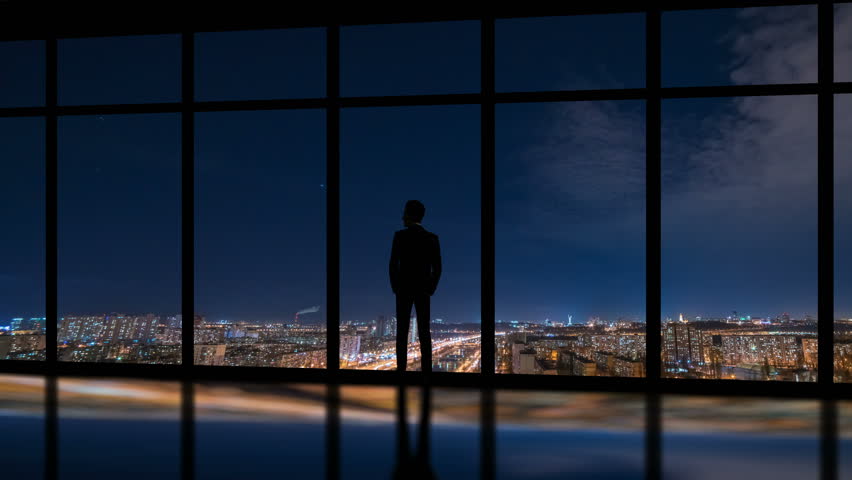 man standing near window on night Stock Footage Video (100% Royalty ...