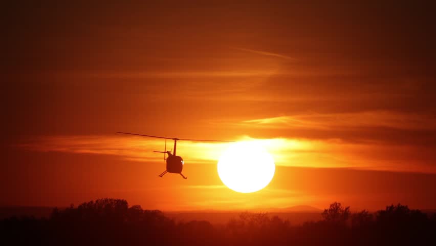 Helicopter On Sunset Background. Silhouette Stock Footage Video (100% ...