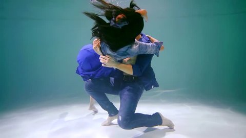 Muscular Man Catches Falling Woman Blue Stock Footage Video (100% ...