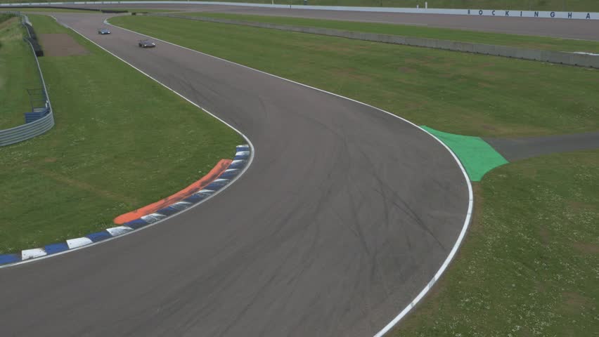 Two cars racing around the track image - Free stock photo - Public ...