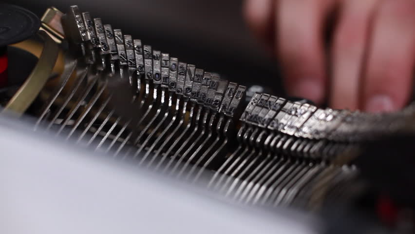 In the office working man concentrated typing some notes on the ...