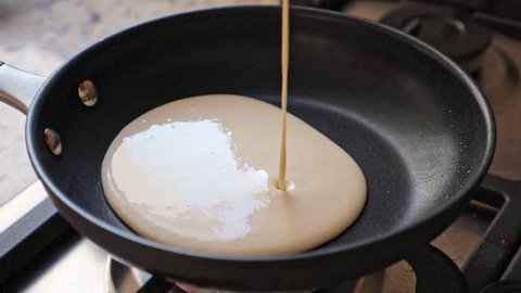 Pouring Pancake Mixture On Frying Pan Stock Footage Video (100% Royalty ...