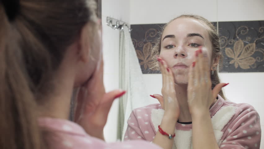 teen girl washing cleaning moisturizing face Stock Footage Video (100% ...