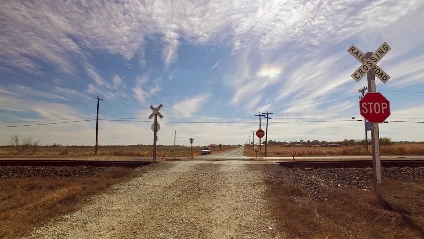 Car Approaching a Railroad Crossing Stock Footage Video (100% Royalty ...