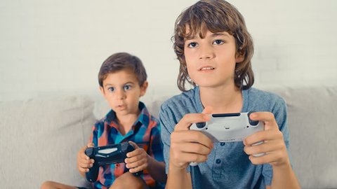 Two Boys Playing Video Game Console Stock Footage Video (100% Royalty ...