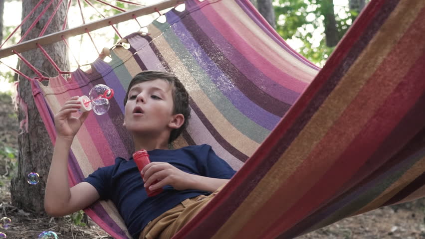 slow motion slide happy boy lying Stock Footage Video (100% Royalty ...