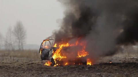 car on fire burning field front Stock Footage Video (100% Royalty-free ...