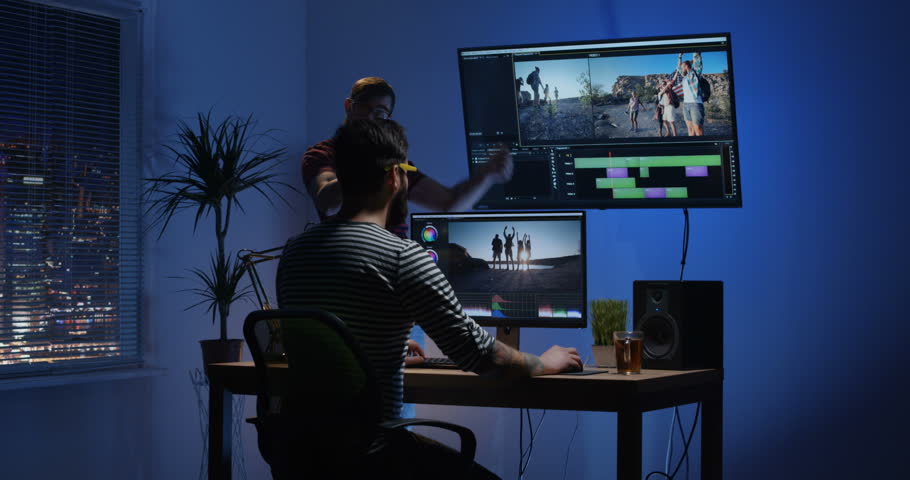 medium shot young man editing video Stock Footage Video (100% Royalty ...