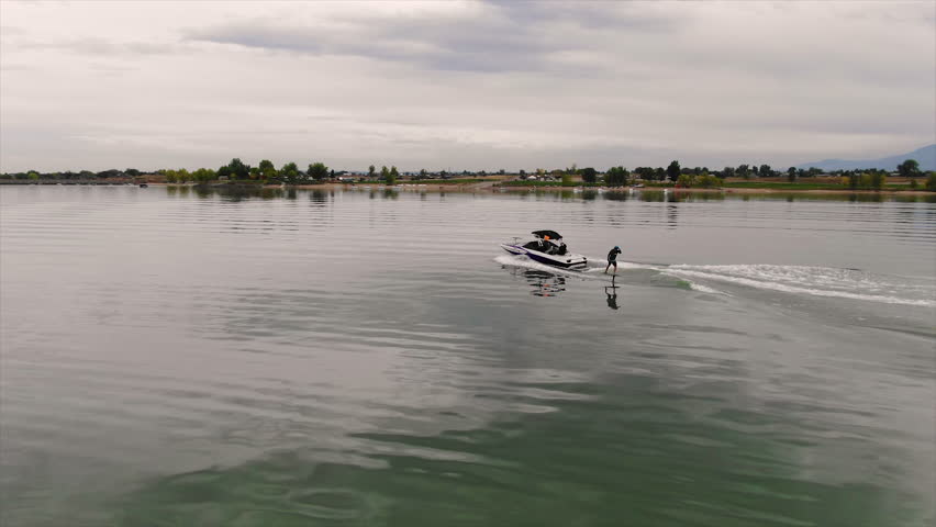man surfing hovering over water behind Stock Footage Video (100% ...