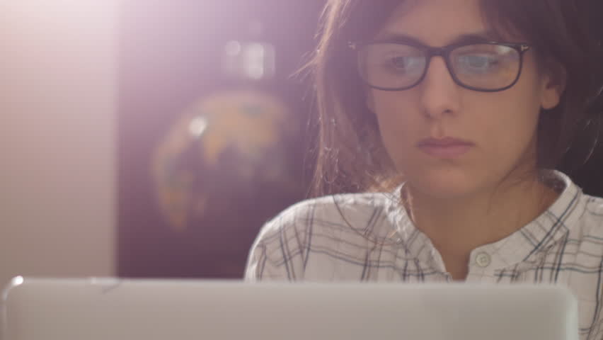 young female looking into computer screen Stock Footage Video (100% ...