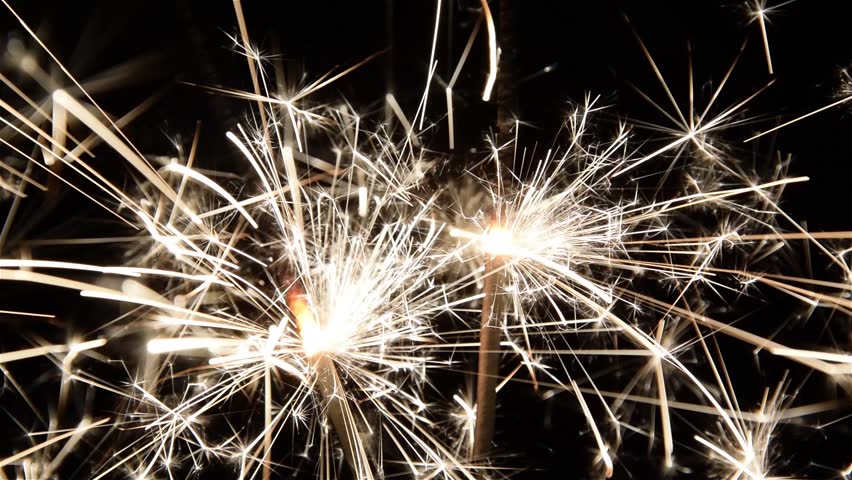 2 sparklers sparkling holiday sticks burning Stock Footage Video (100% ...
