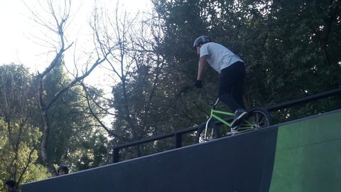 Cyclist Slides Down Ramp Slow Motion: video stock (100% royalty free ...
