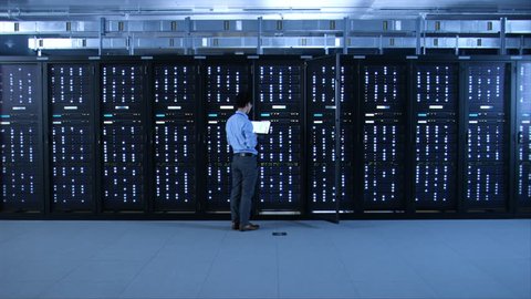 Specialist Standing Front Server Racks Laptop Stock Footage Video (100% ...