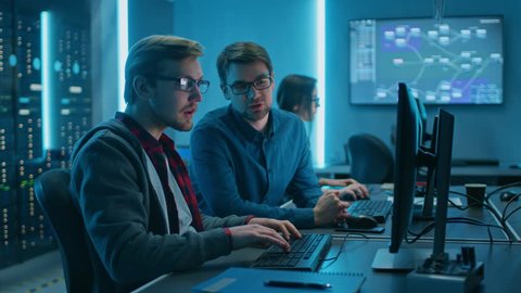 Two Professional Programers Discussing Technical Data Stock Footage ...