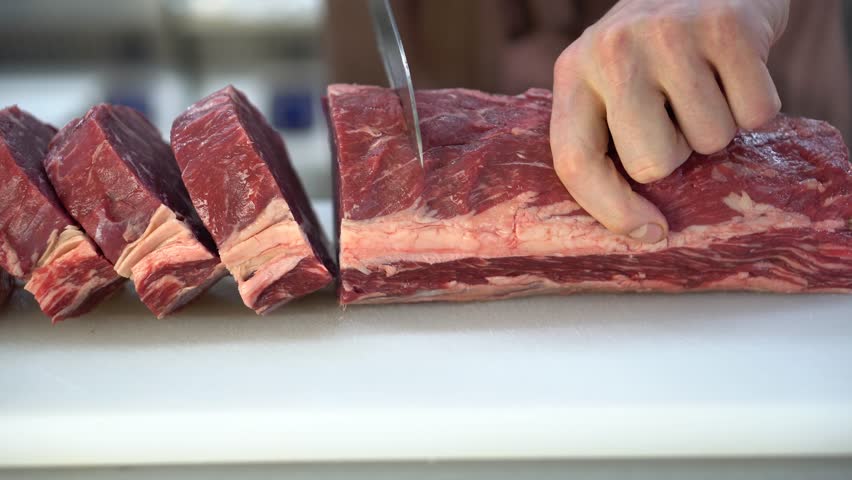 Cutting Steaks from a Ribeye. Stock Footage Video (100% Royalty-free ...