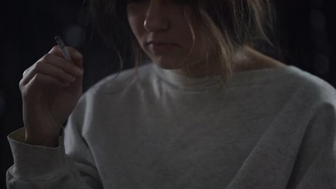 crying miserable woman smoking cigarette behind Stock Footage Video ...