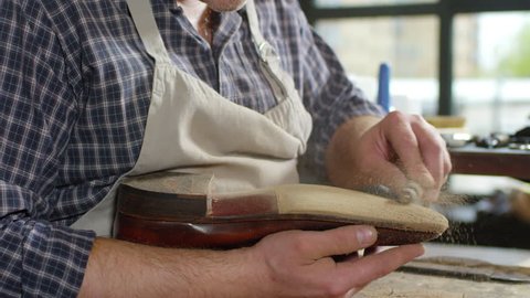 Midsection Male Shoemaker Grinding Boot Sole Stock Footage Video (100% ...
