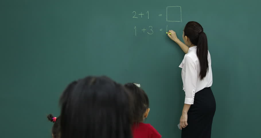 Asian Teacher Writes Math Problem Stock Footage Video (100% Royalty ...