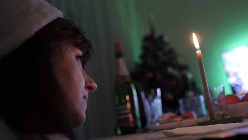 lonely woman looks burning candle new Stock Footage Video (100% Royalty ...