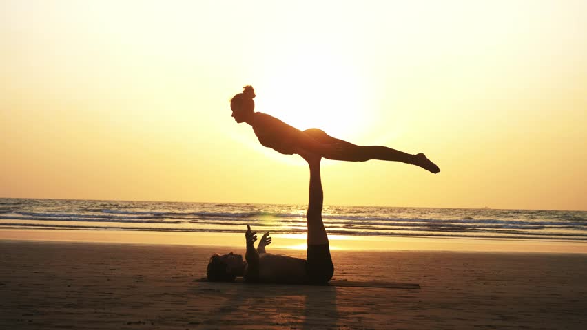 somersault-pose-of-young-women-on-beach image - Free stock photo ...