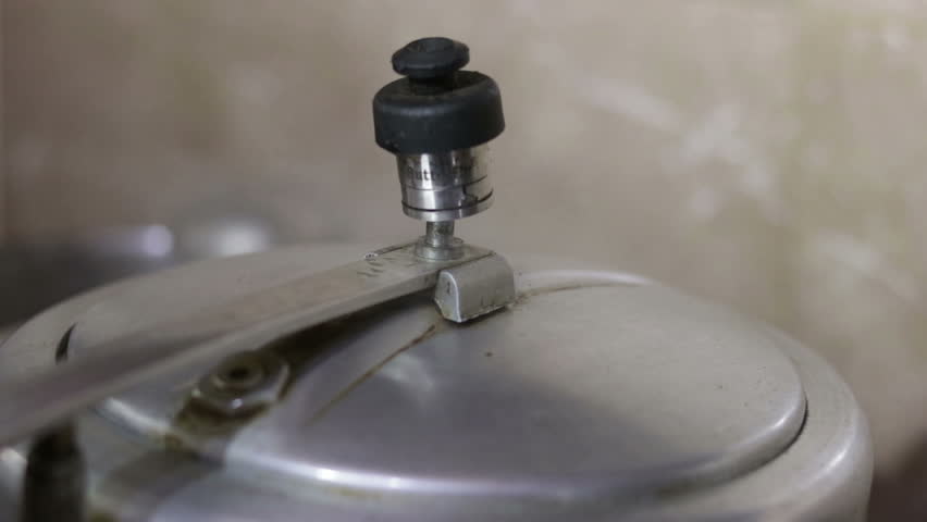 pressure cooker getting whistle while cooking Stock Footage Video (100% ...