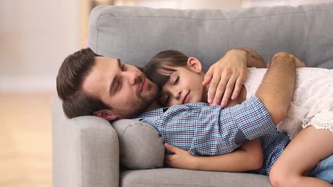 Happy Father Lying On Sofa Hugging: video de stock (totalmente libre de regalías) 1025766269 ...